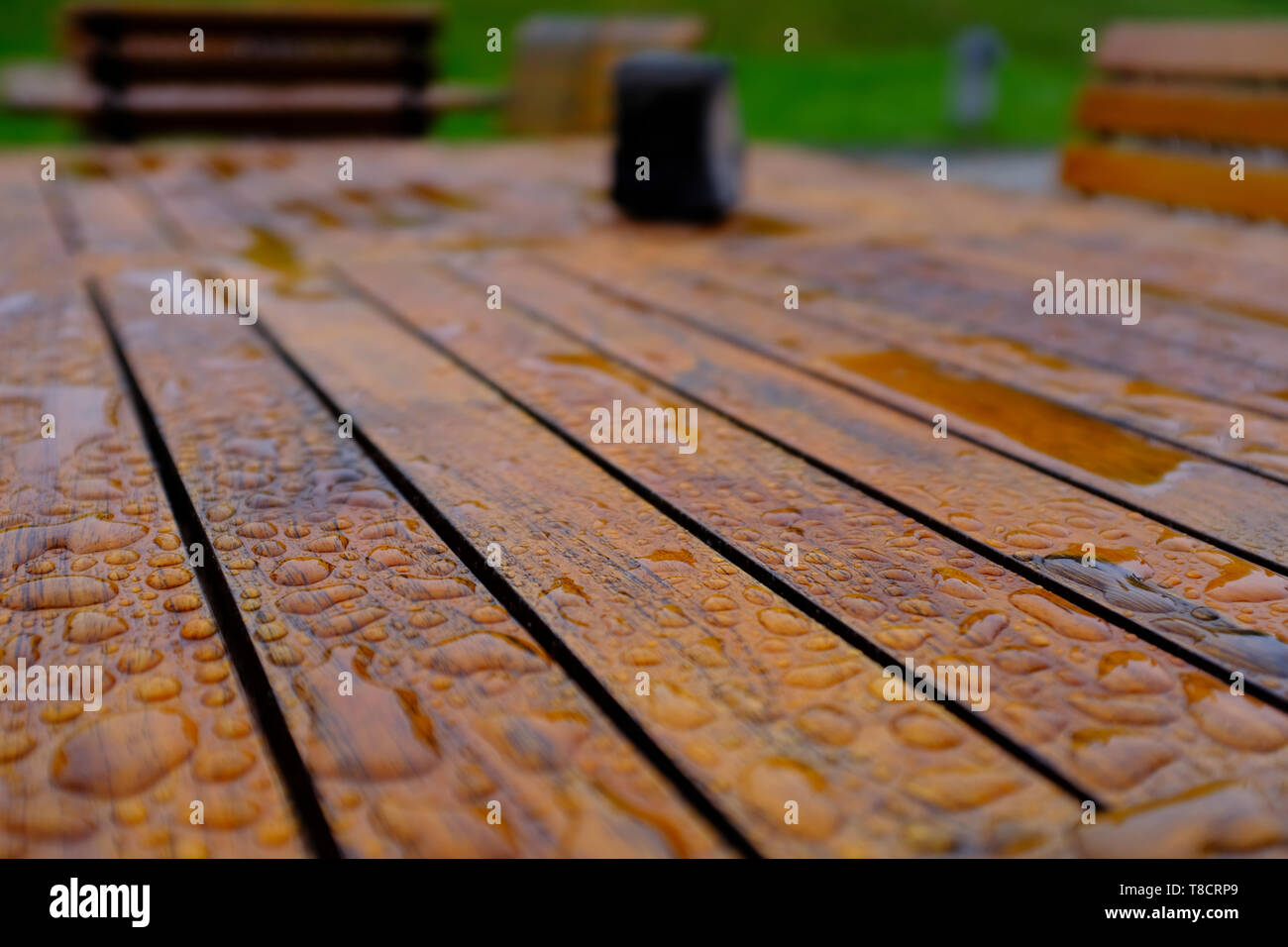 Rain water on an outdoor table Stock Photo - Alamy