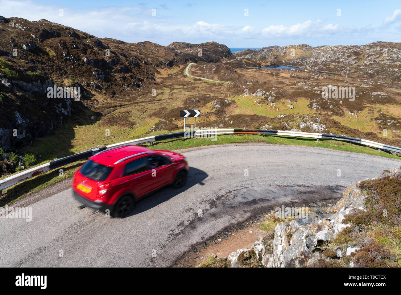 Single track road and car on the North Coast 500 scenic driving route ...