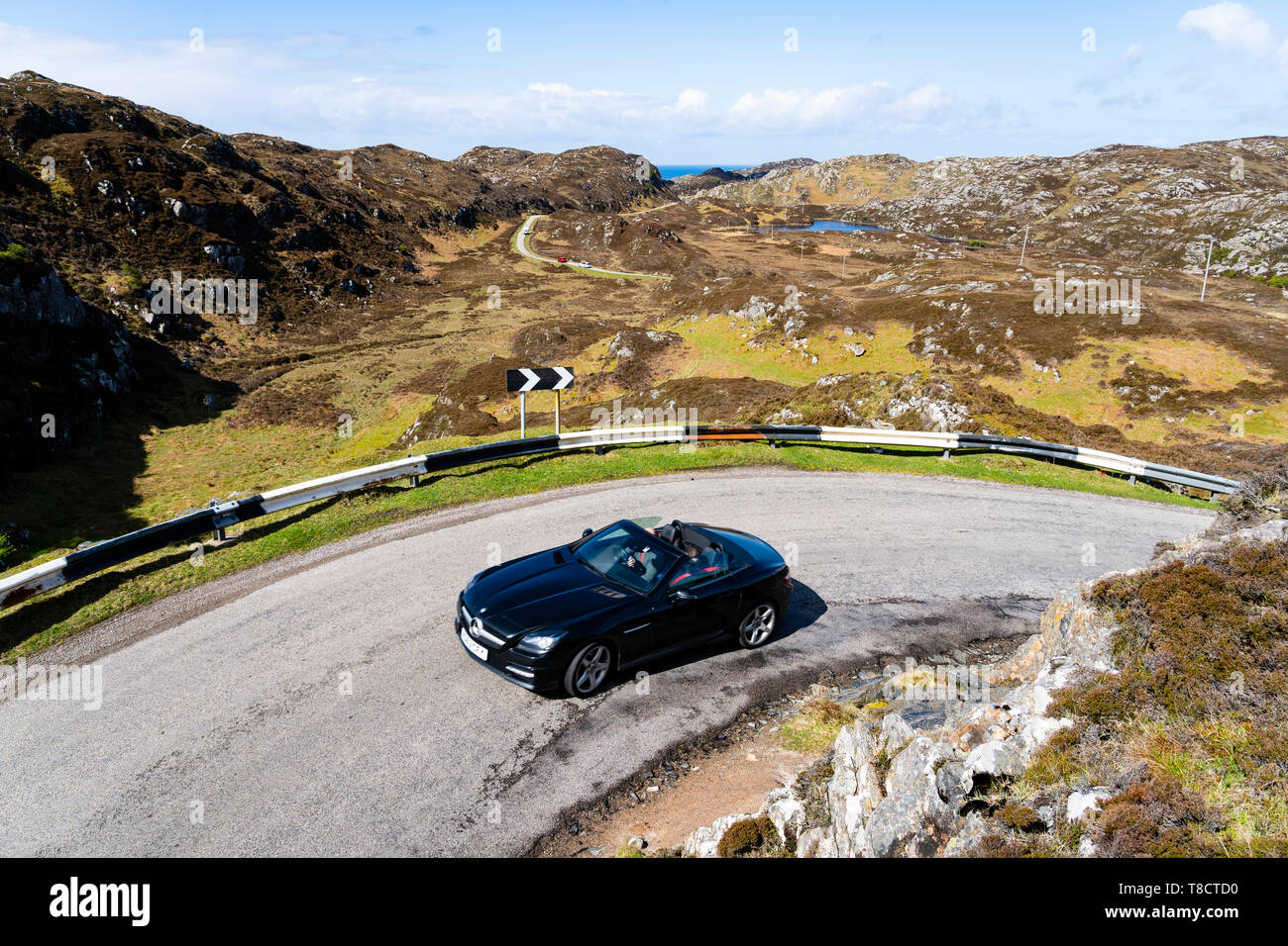 Single track road and car on the North Coast 500 scenic driving route ...