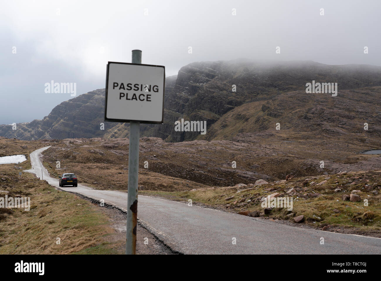 View of single track road and passing place on Bealach na Ba pass on ...