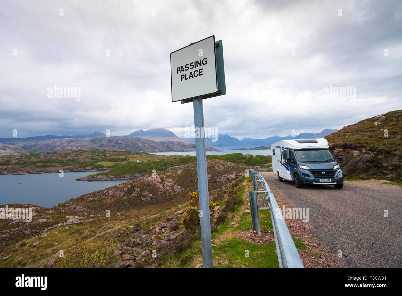 Single track road and passing place and tourist camper van in Torridon ...