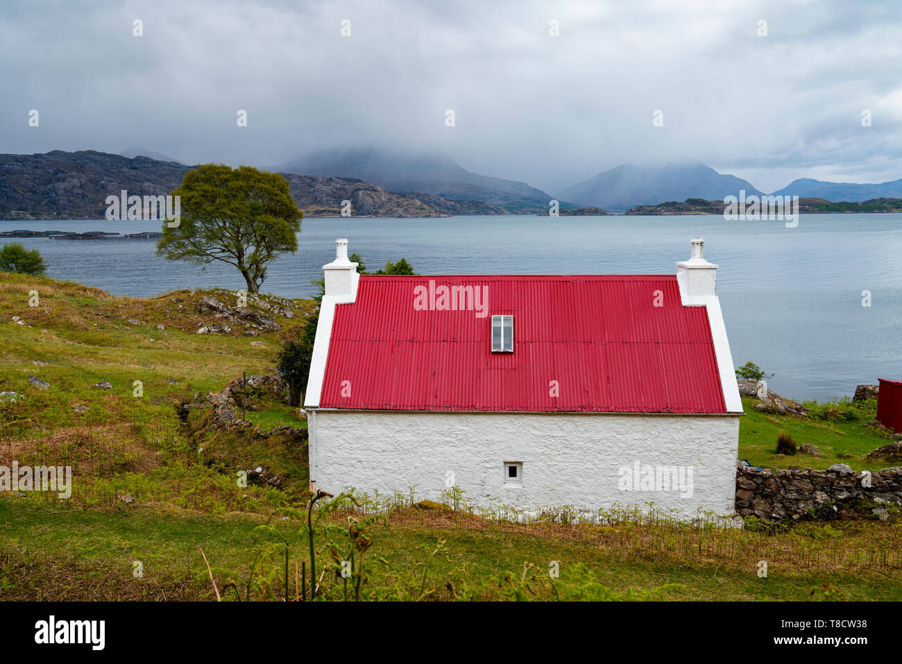 White cottage with red roof in Torridon on the North Coast 500 scenic ...
