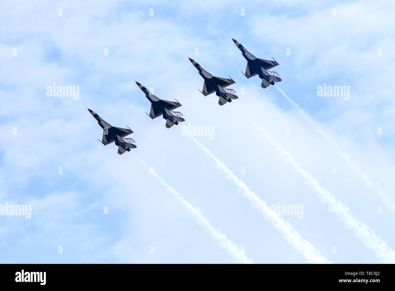 US Air Force Thunderbirds in formation while performing for a crowd at ...