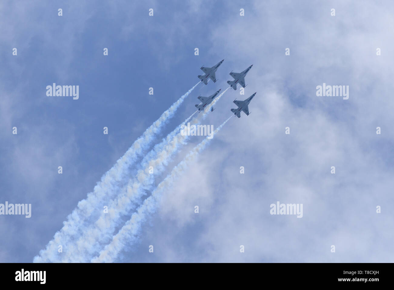 US Air Force Thunderbirds in formation while performing for a crowd at ...