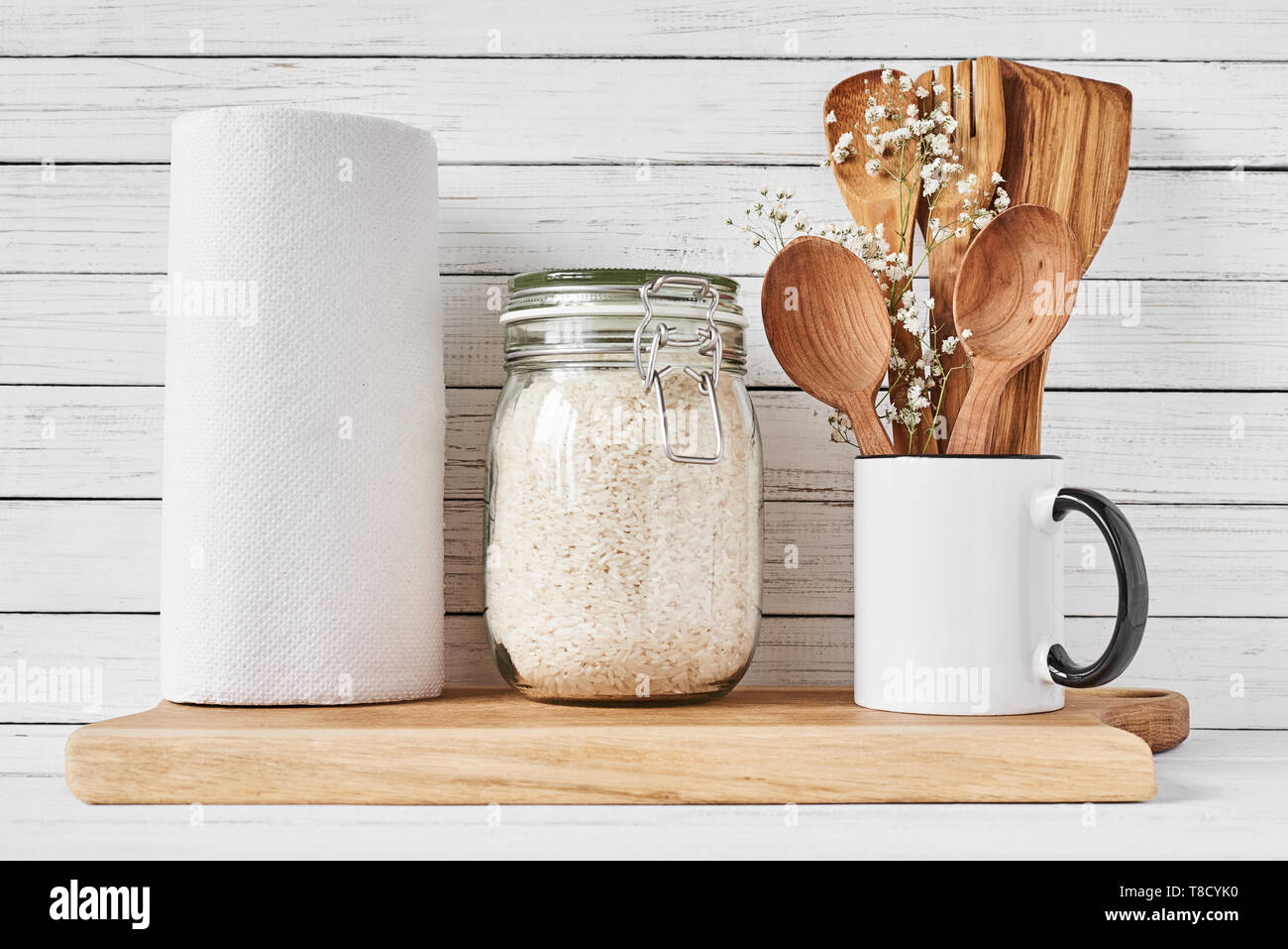 Kitchen tools and cutting board on white table. Kitchen utensils ...