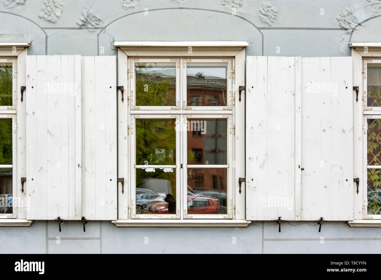 Rectangular window with open white wooden shutters in old Riga Stock ...