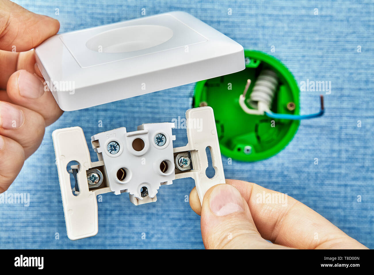 Worker is connecting two parts of new european standard socket with ...