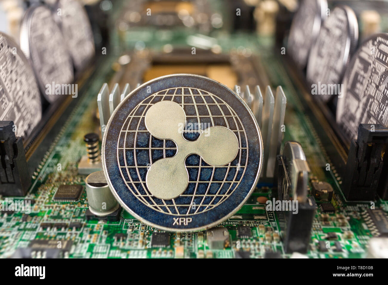 Ripple coin close-up on a computer circuit motherboard as a blockchain ...