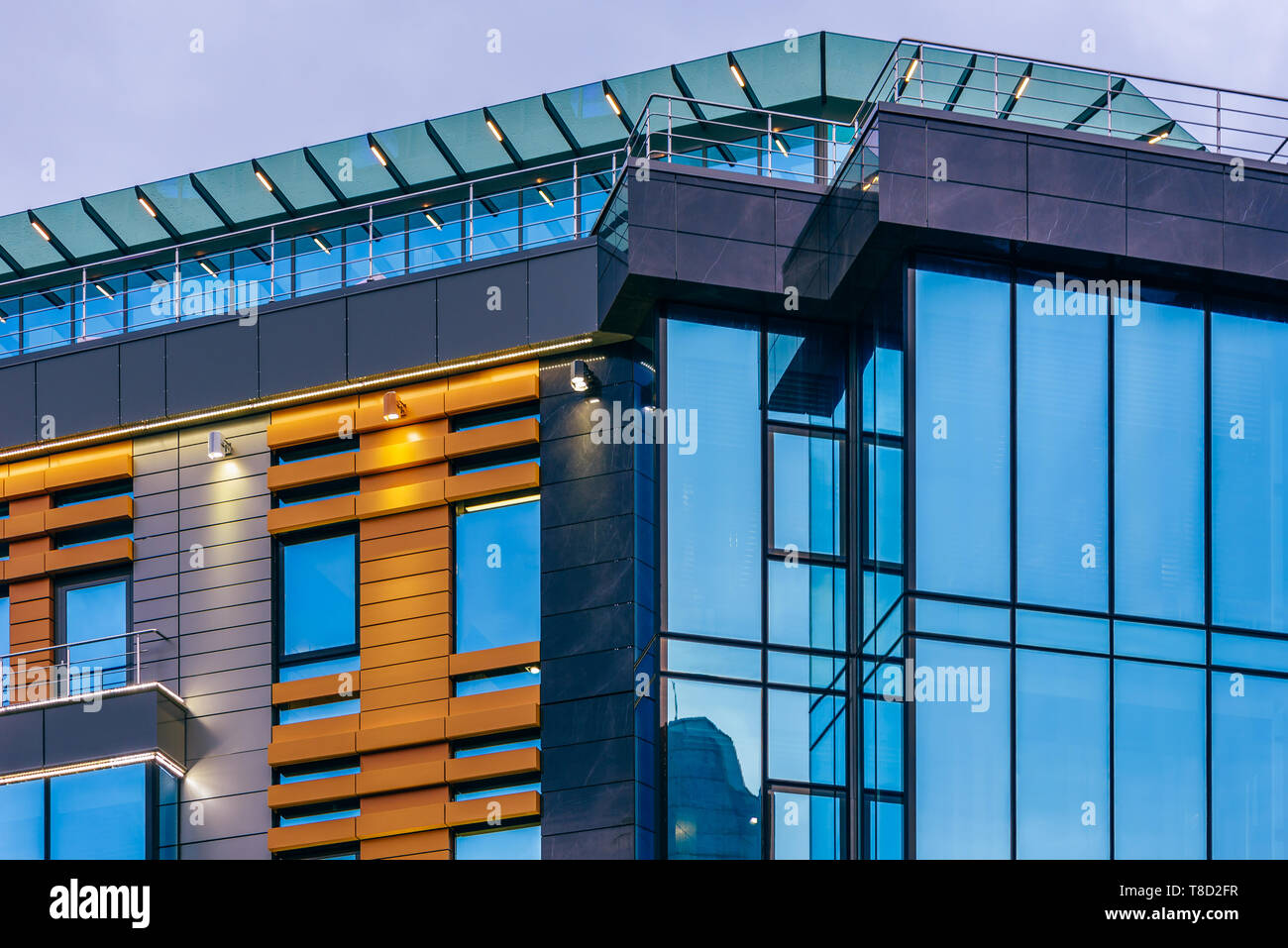 Modern high-rise office building with a glass facade at overcast ...