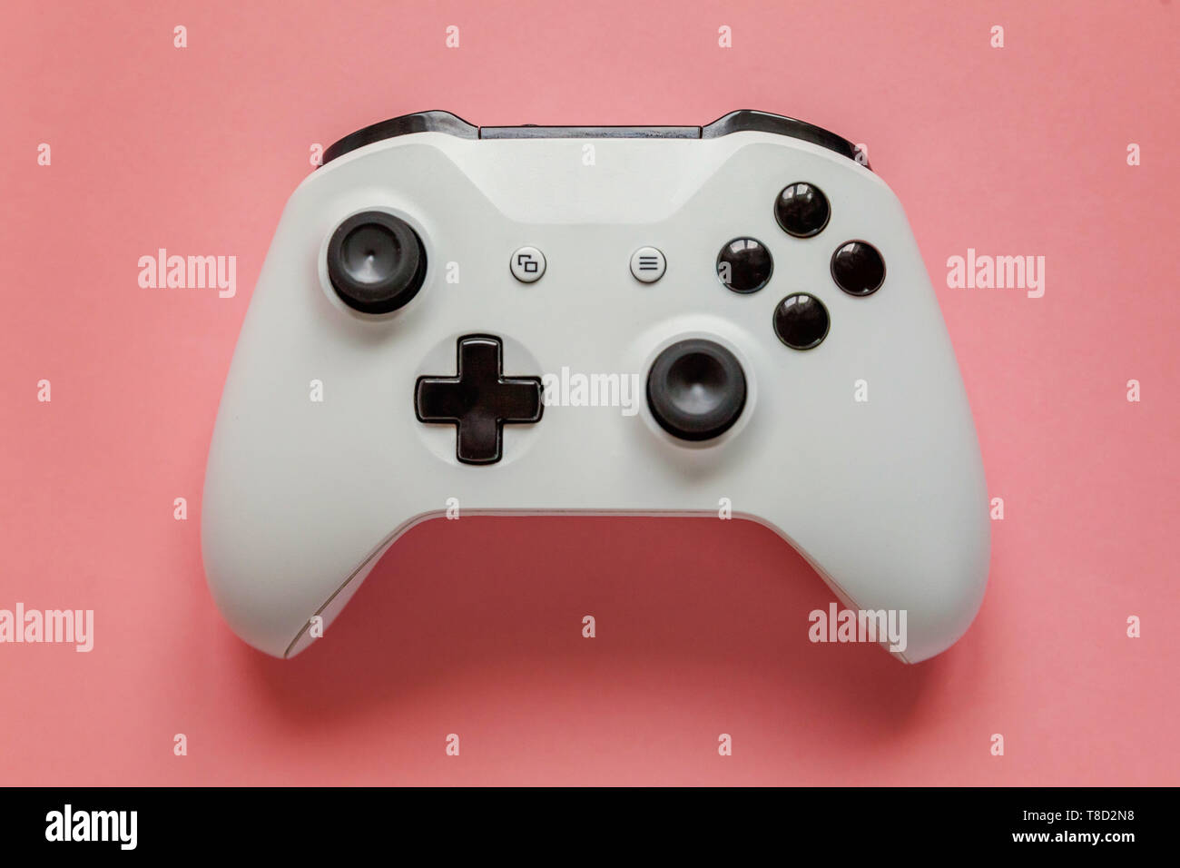 White joystick gamepad, game console on pastel pink colourful trendy ...