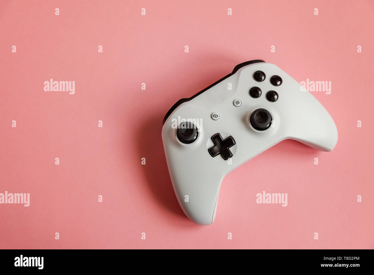 White joystick gamepad, game console on pastel pink colourful trendy ...