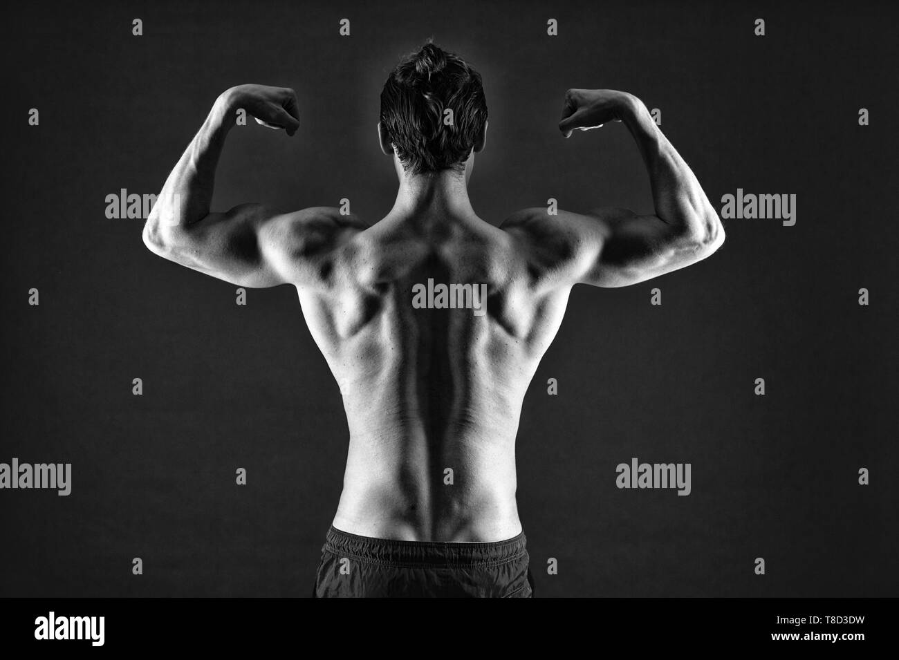 Attractive guy muscular back. Proud of excellent shape. Muscular ...