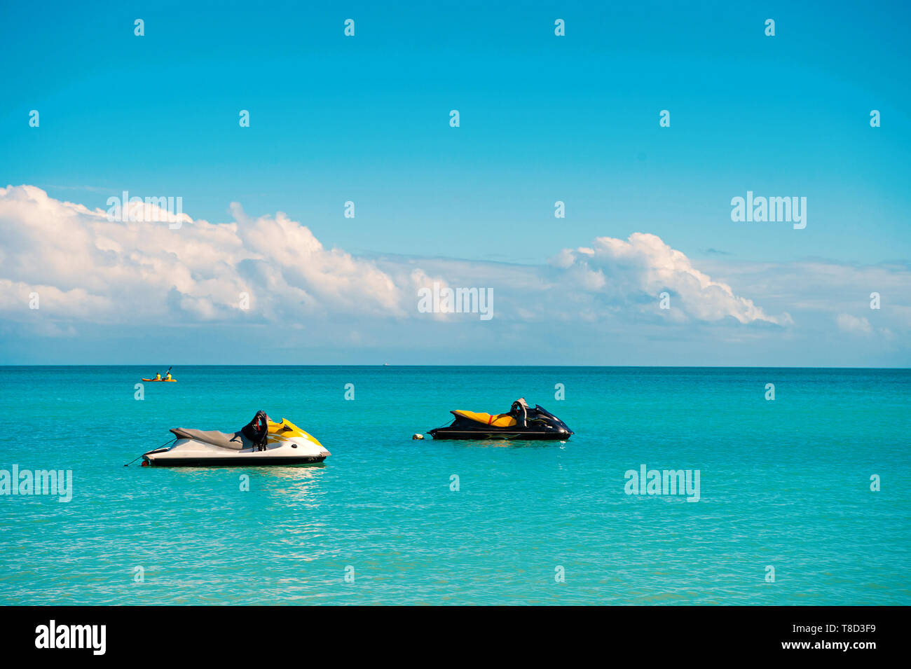 Extreme entertainment. Pair water scooter in turquoise ocean lagoon ...