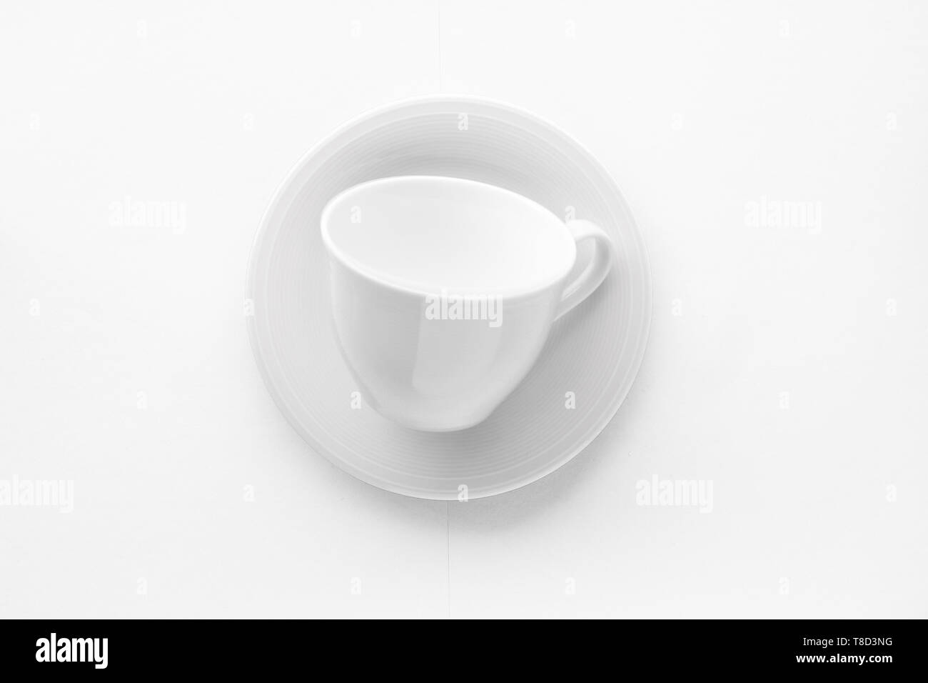 Kitchen, dishware design and drink concept - Empty cup and saucer ...
