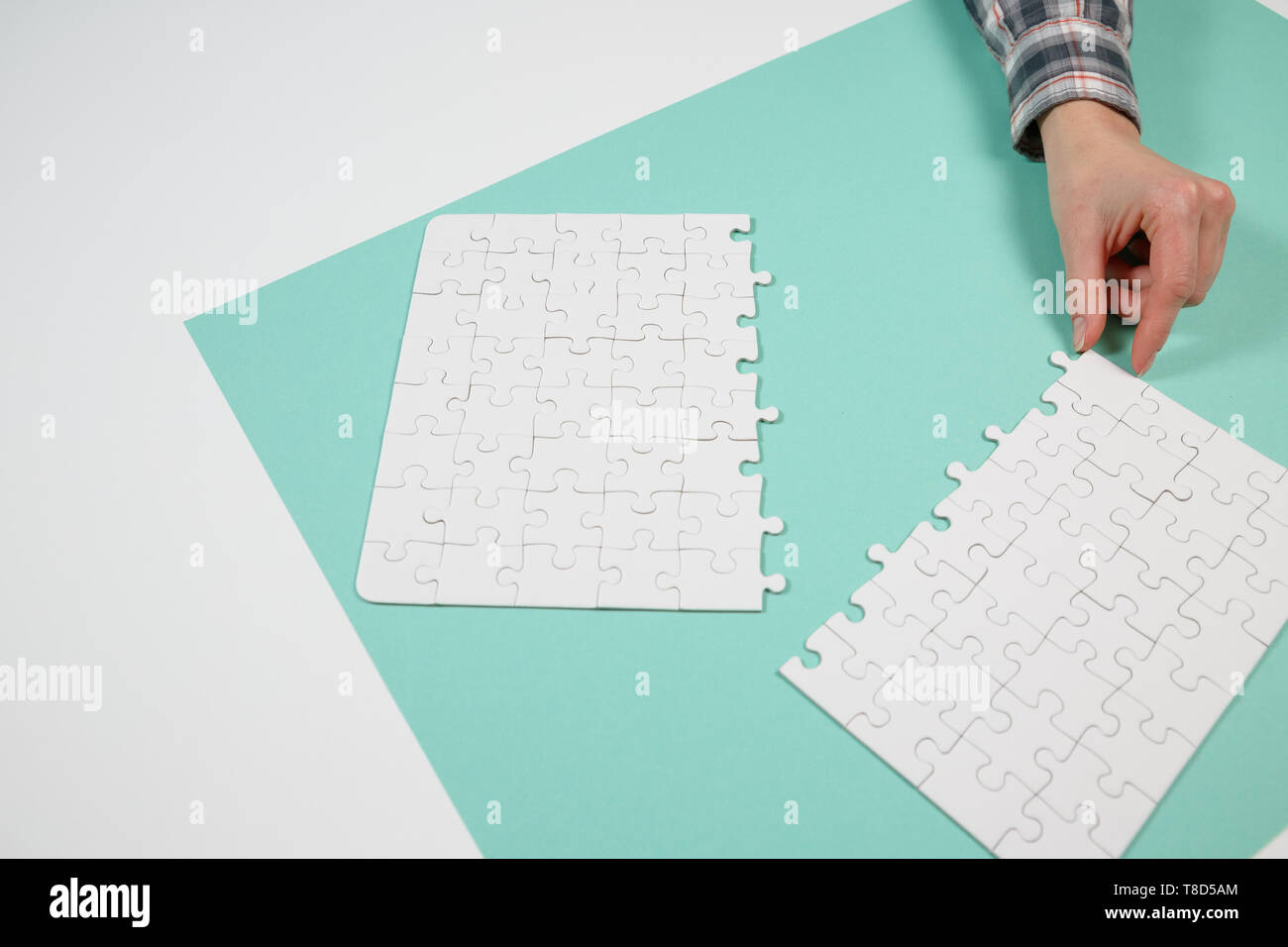 Hands assembling jigsaw puzzle, to find common solution concept Stock ...