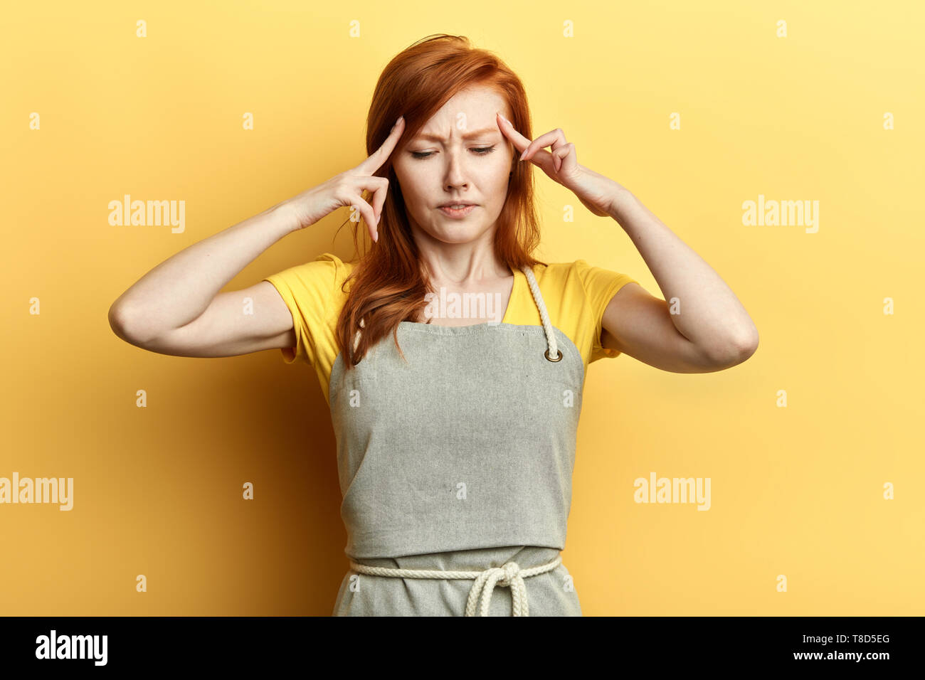 Woman fingers on temples hi-res stock photography and images - Alamy