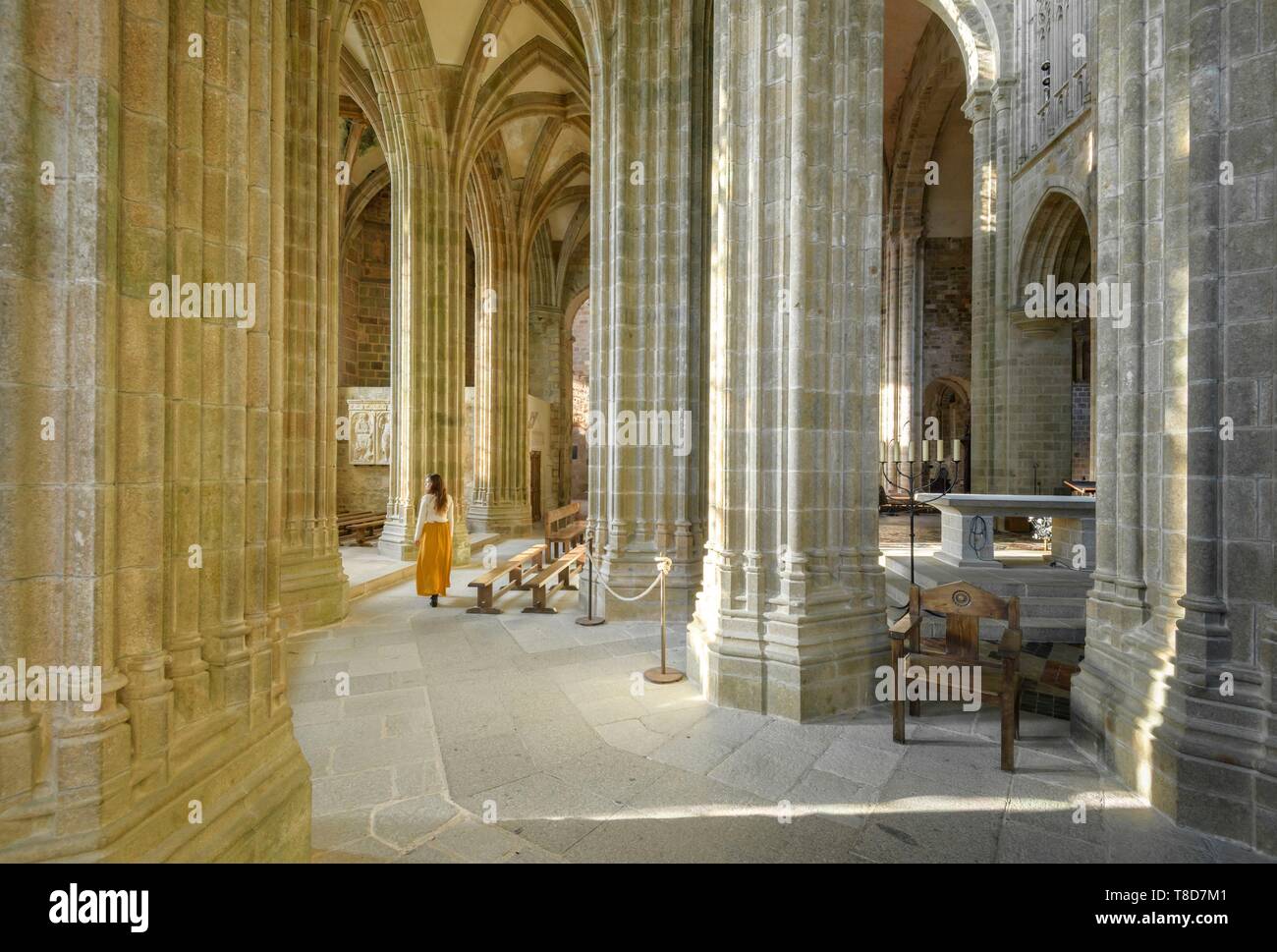 France, Manche, the Mont-Saint-Michel, young woman in church interior's ...