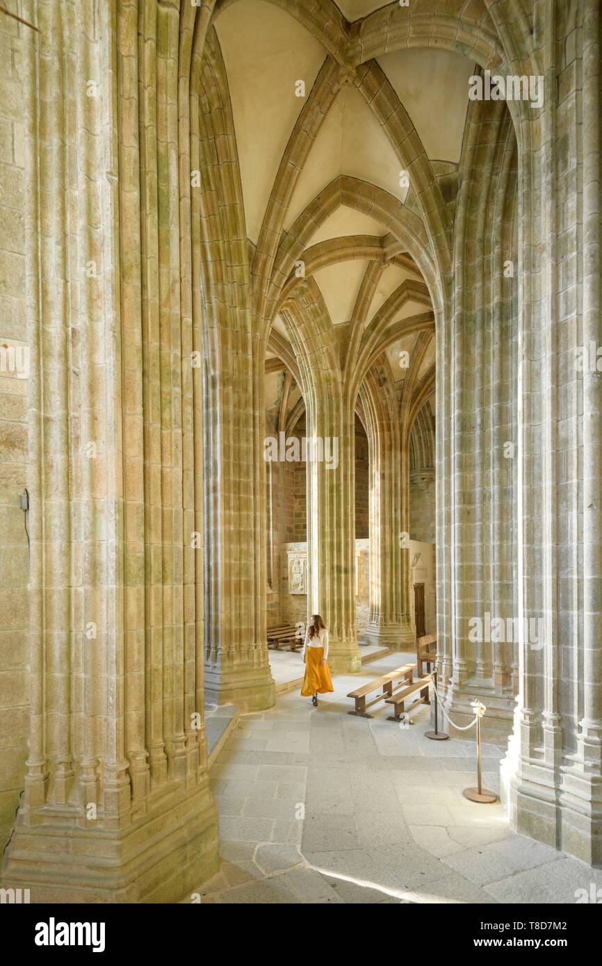 France, Manche, the Mont-Saint-Michel, young woman in church interior's ...