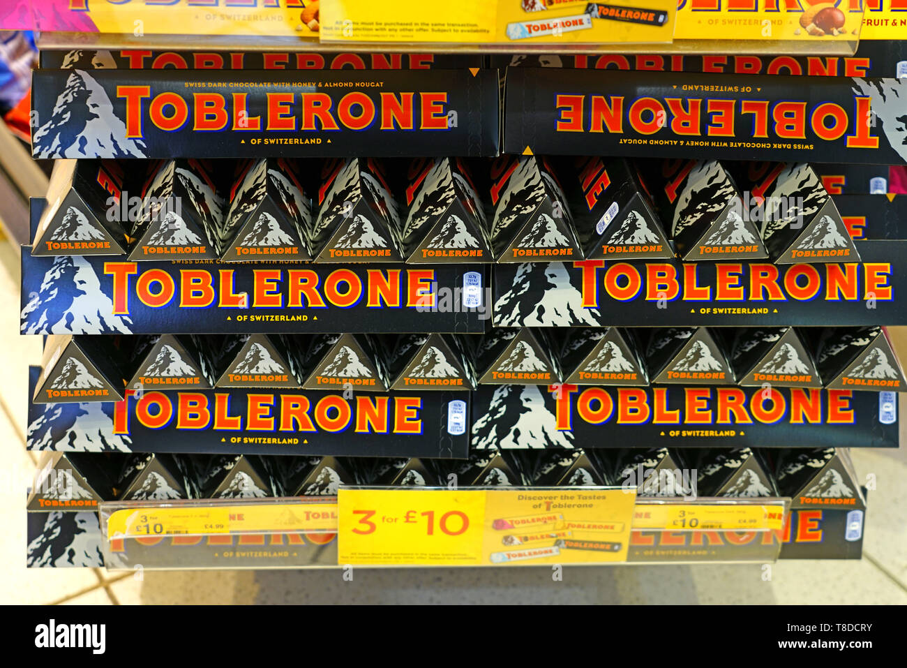 HEATHROW, ENGLAND -3 APR 2019- View of packages of Toblerone, a Swiss ...