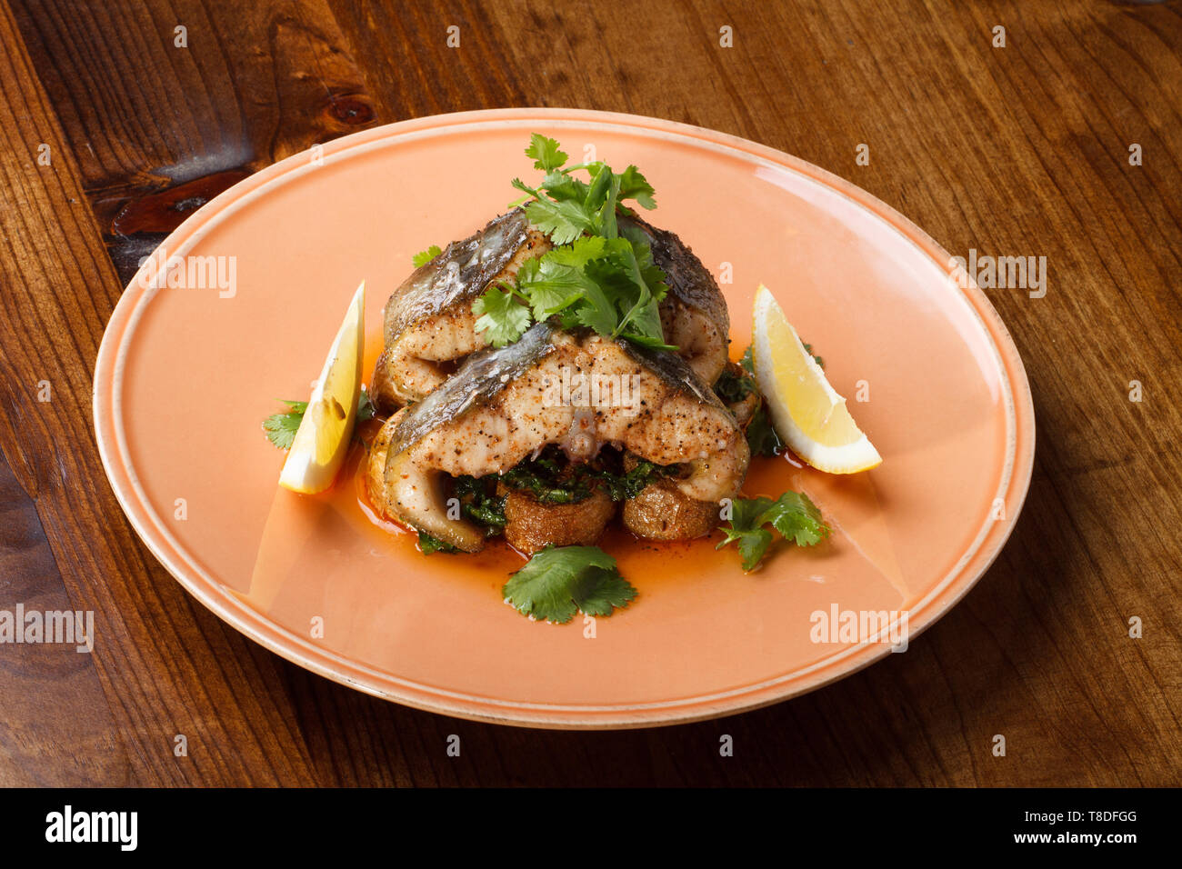 Oven Roasted Sturgeon fish served with Potatoes, Lime, Ghee and ...