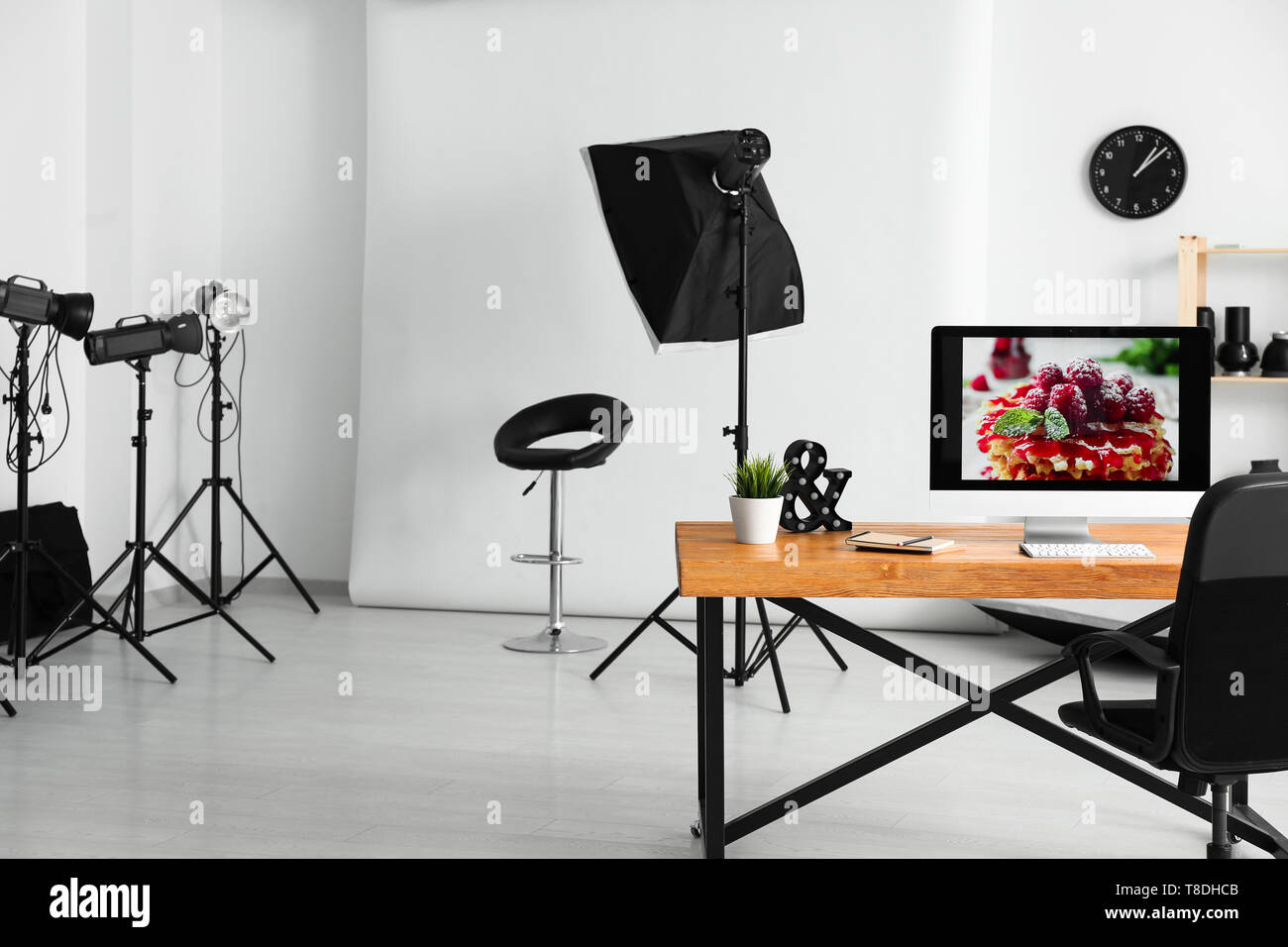 Interior of modern photo studio with comfortable workplace Stock Photo ...