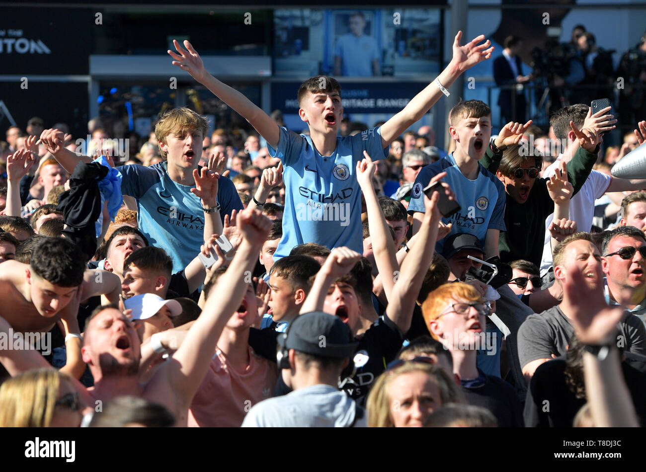 Manchester City fans celebrate at the Etihad Stadium, Manchester Stock ...