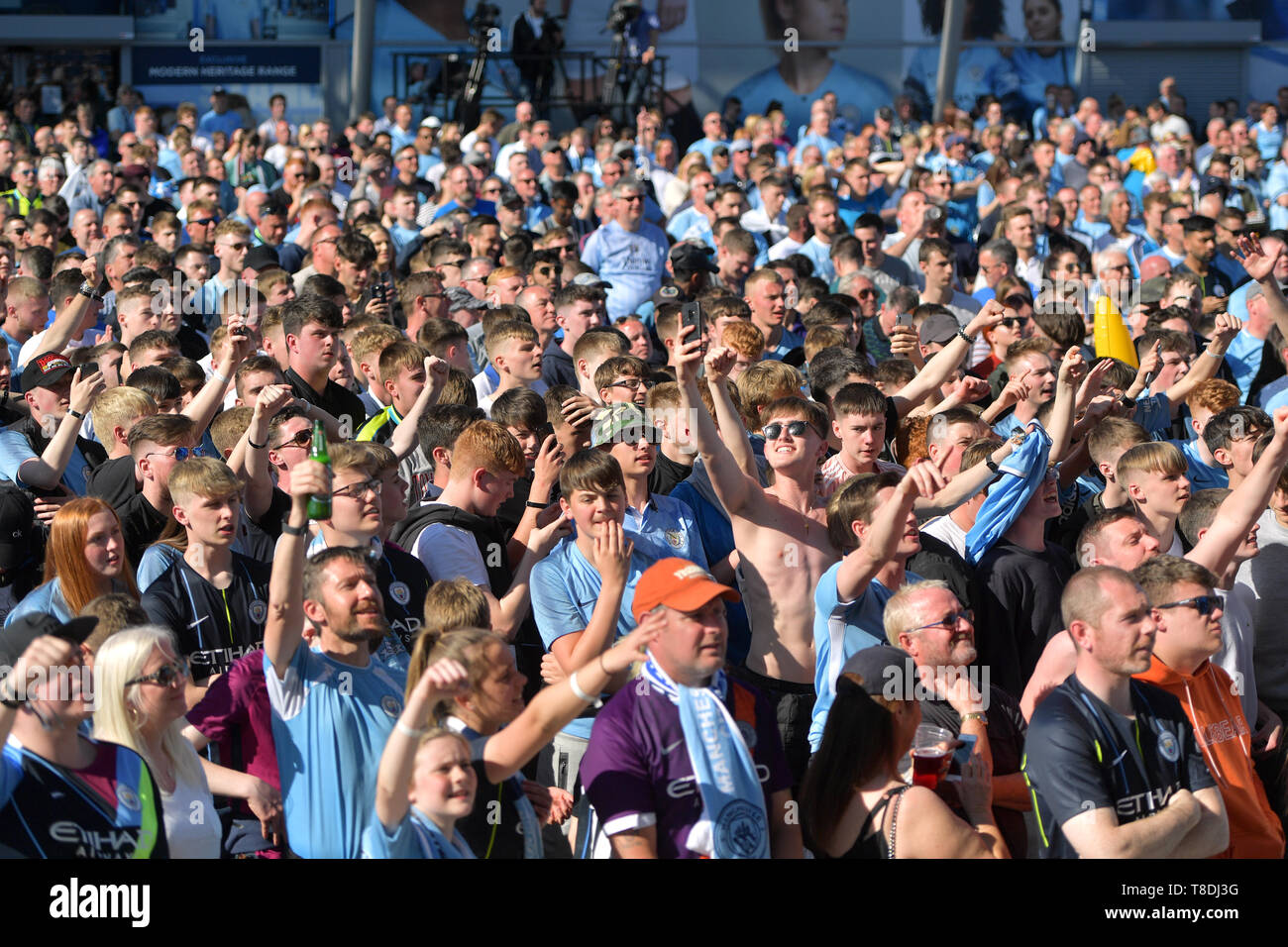 Manchester City fans celebrate at the Etihad Stadium, Manchester Stock ...