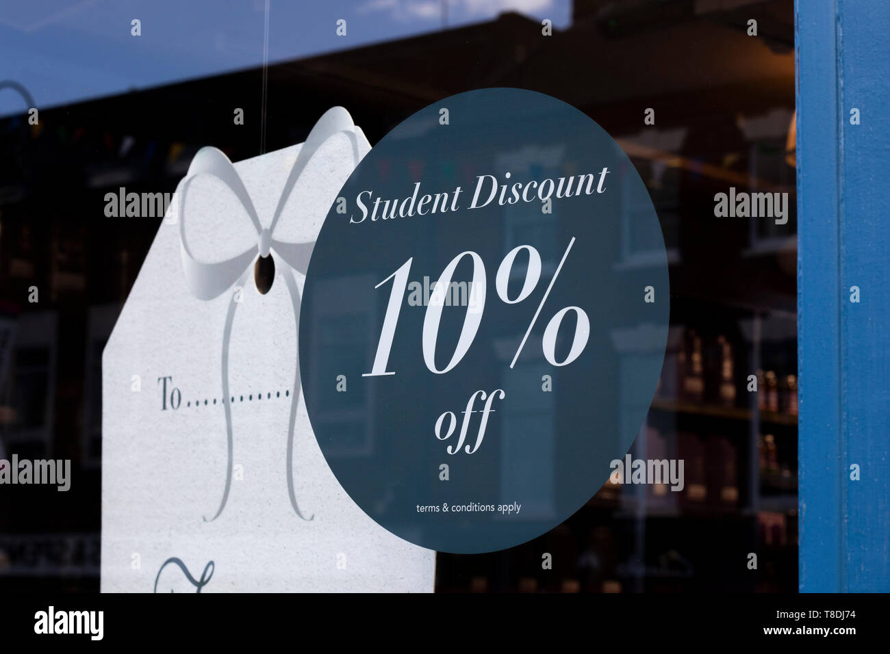 ten percent student discount sign in high street clothing shop window ...