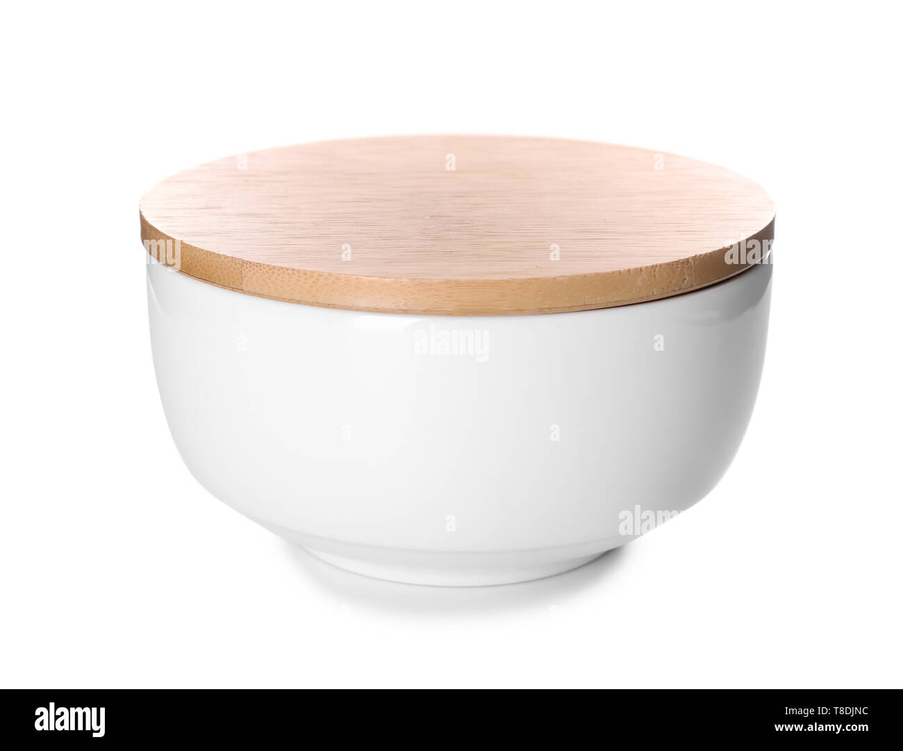 Clean bowl with wooden cover on white background Stock Photo - Alamy