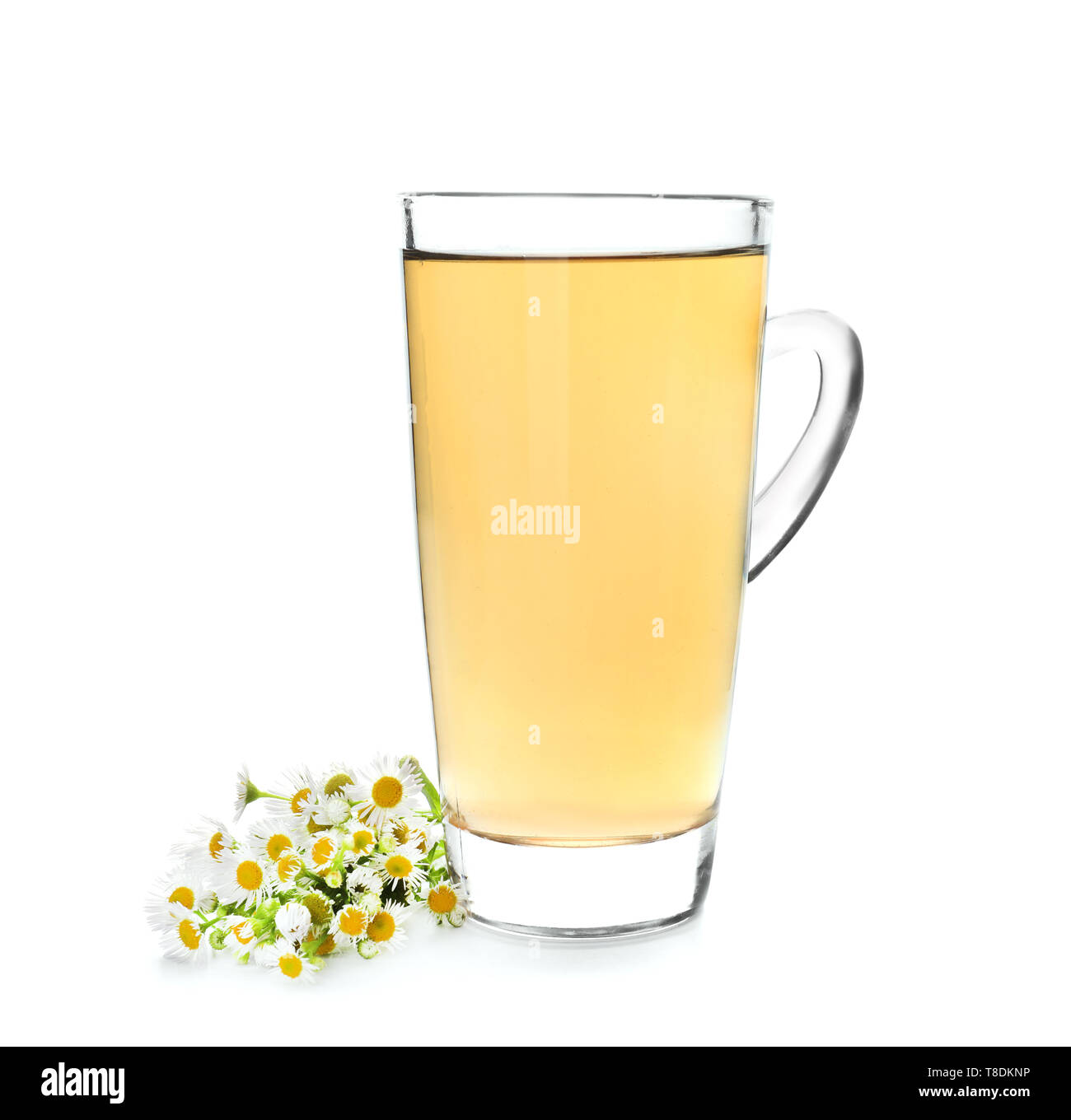 Glass cup of camomile tea on white background Stock Photo - Alamy