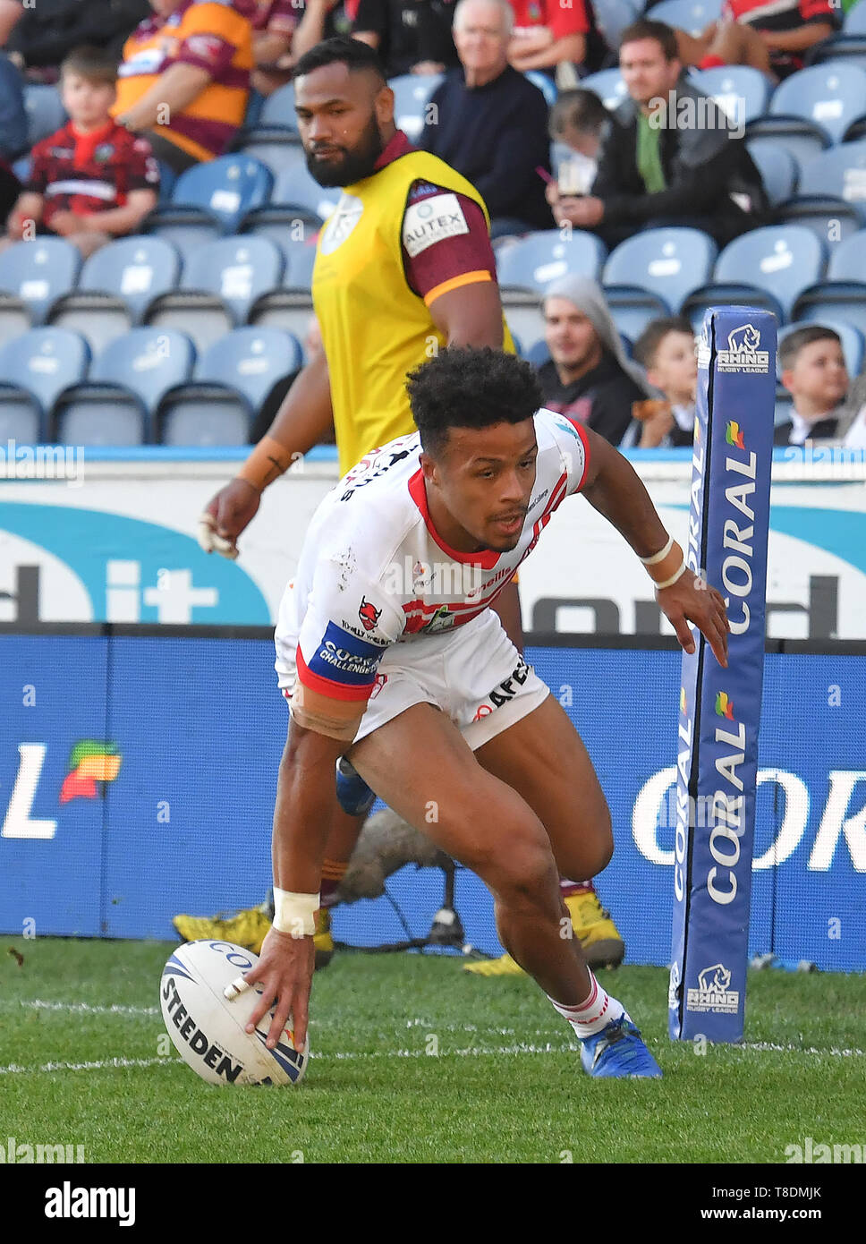 St Helens' Regan Grace scores his sides opening try during the Coral ...