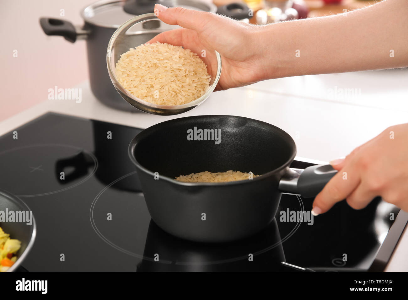Woman pouring rice hi-res stock photography and images - Alamy