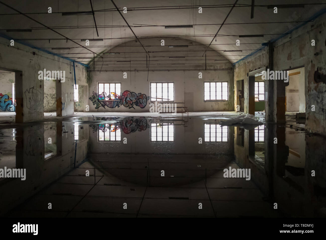 Interior of an abandoned factory, image of a shed with large windows ...