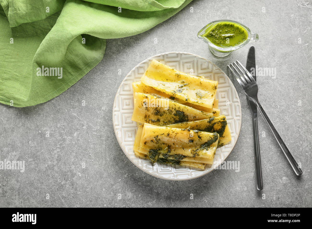 Plate of delicious pasta with pesto sauce on table Stock Photo - Alamy