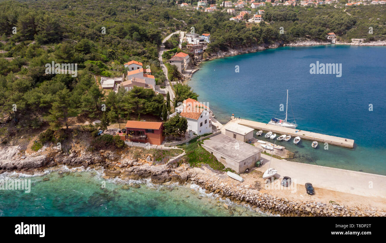 Spectacular aerial landscape with fishing village near peninsula ...