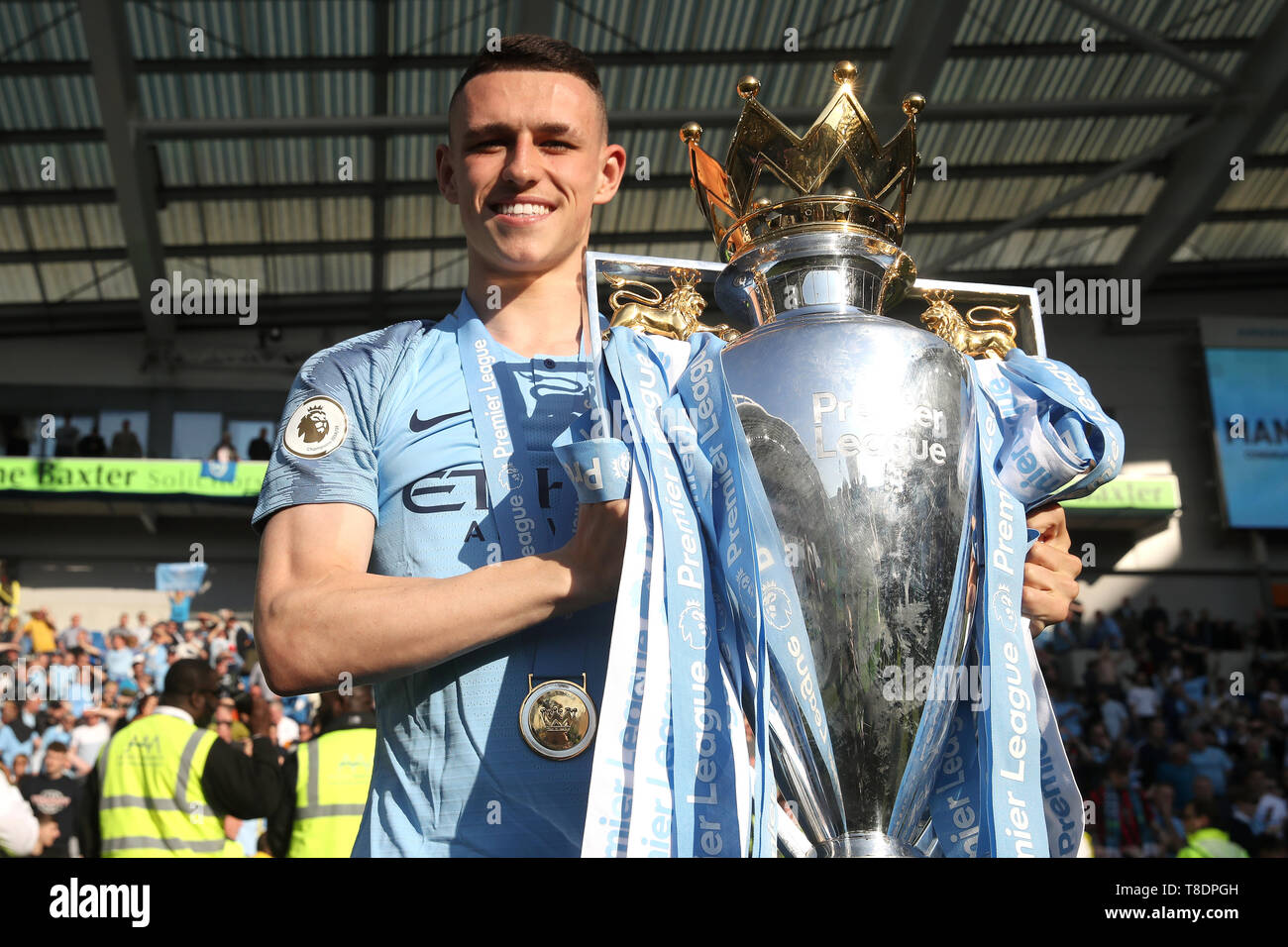 Manchester City's Phil Foden celebrates with the trophy after the match ...