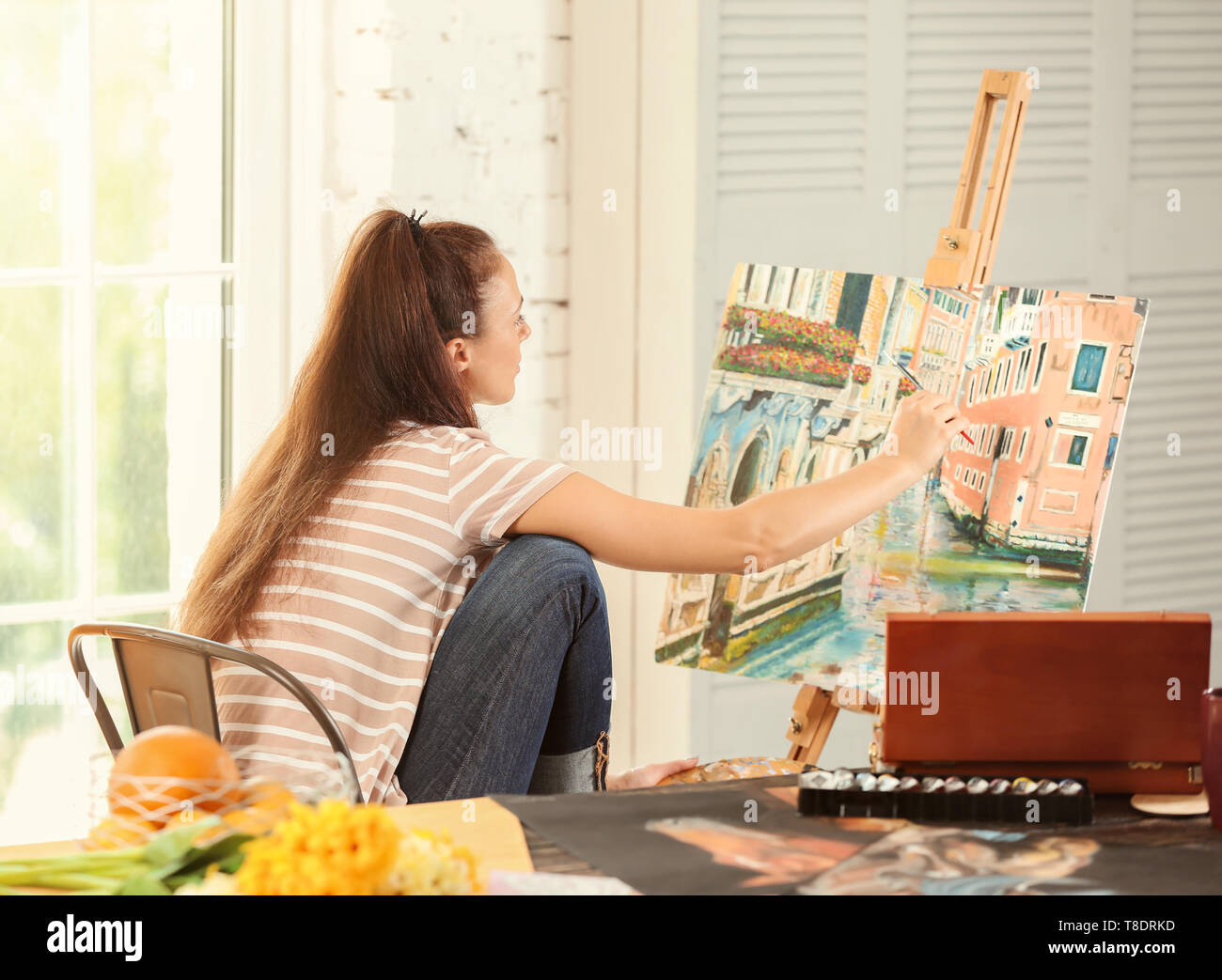 Artist female paints masterpiece sitting hi-res stock photography and ...