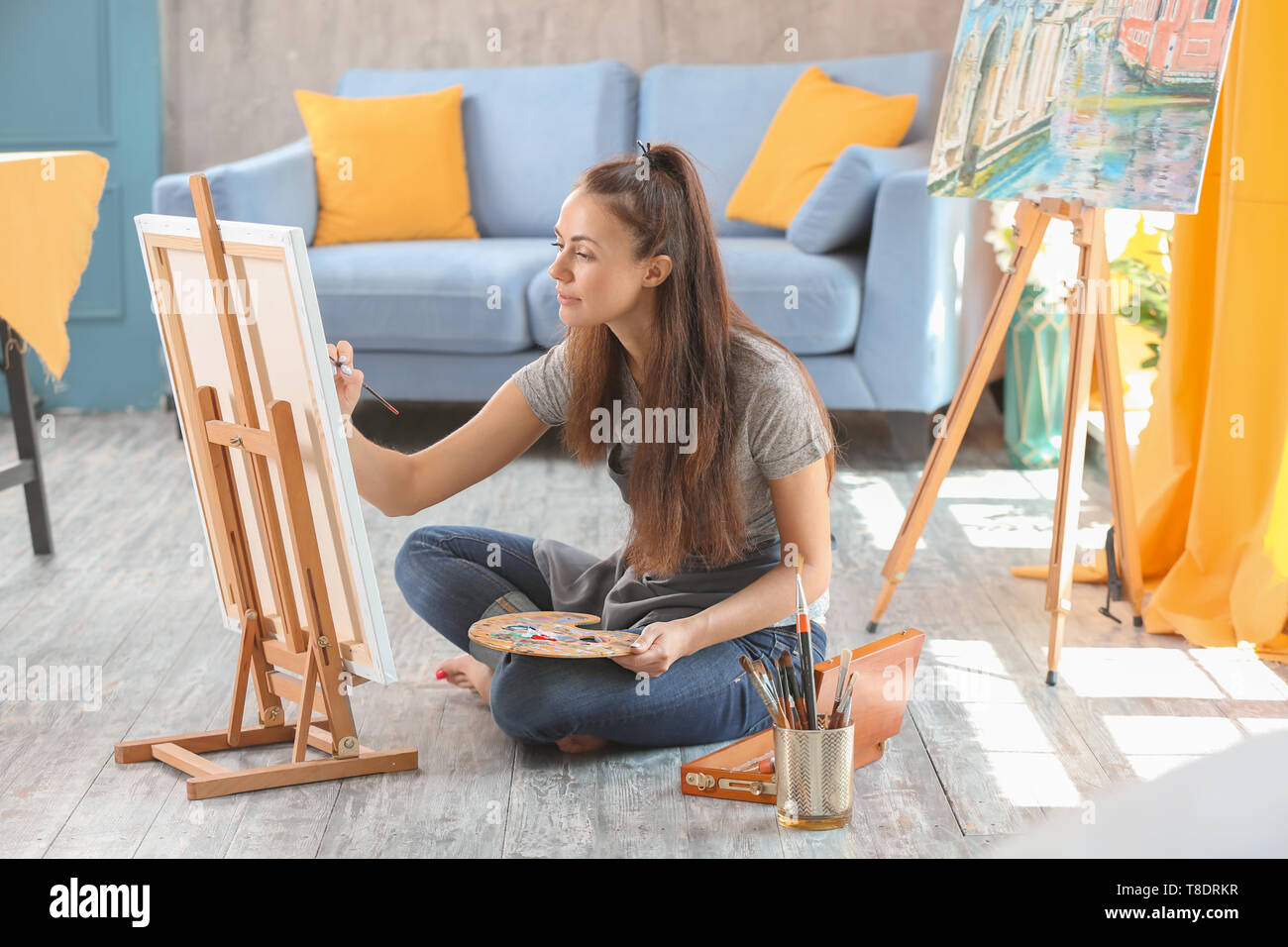 Artist female paints masterpiece sitting hi-res stock photography and ...