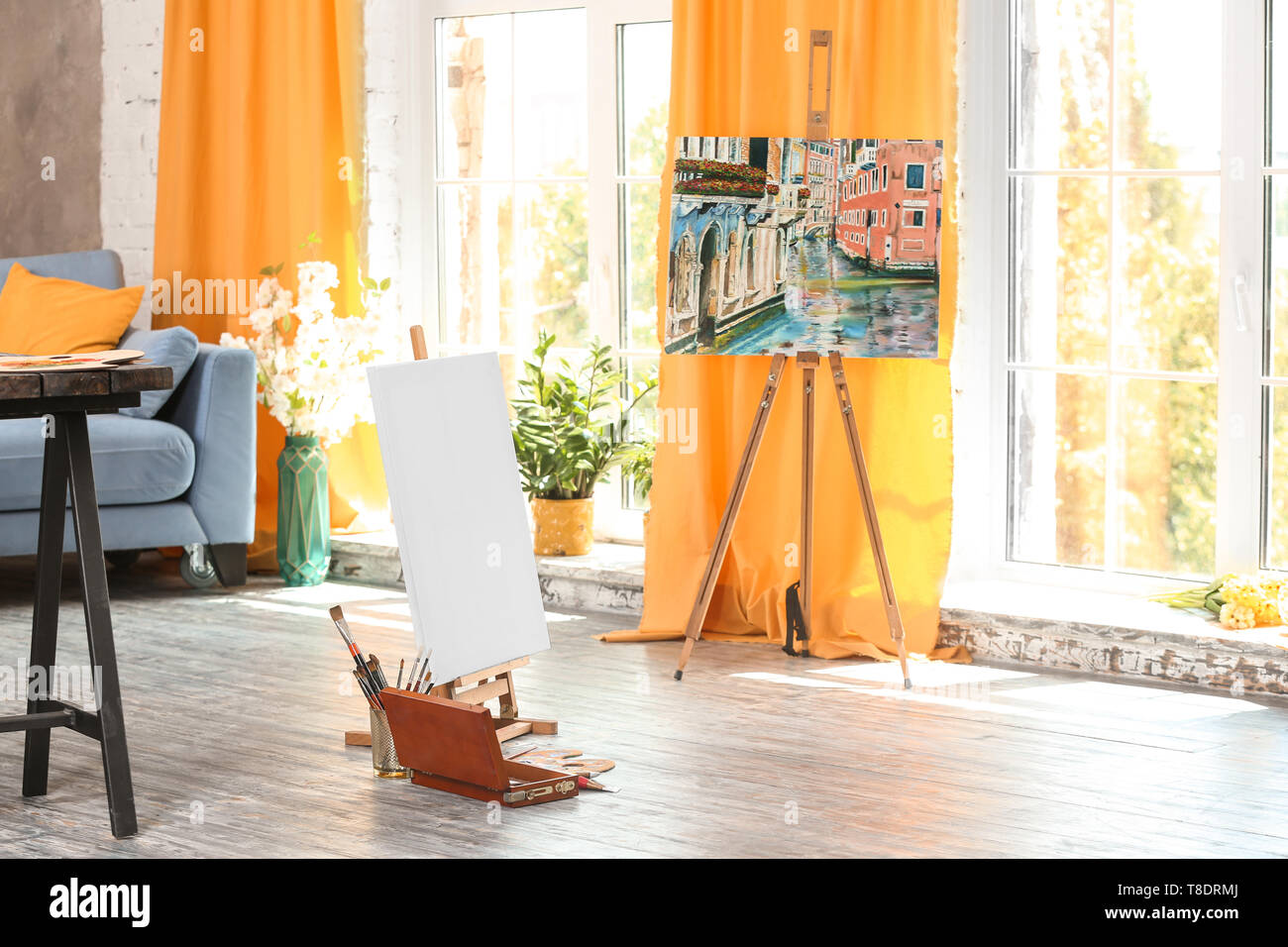Interior of artist's workshop with beautiful picture Stock Photo - Alamy