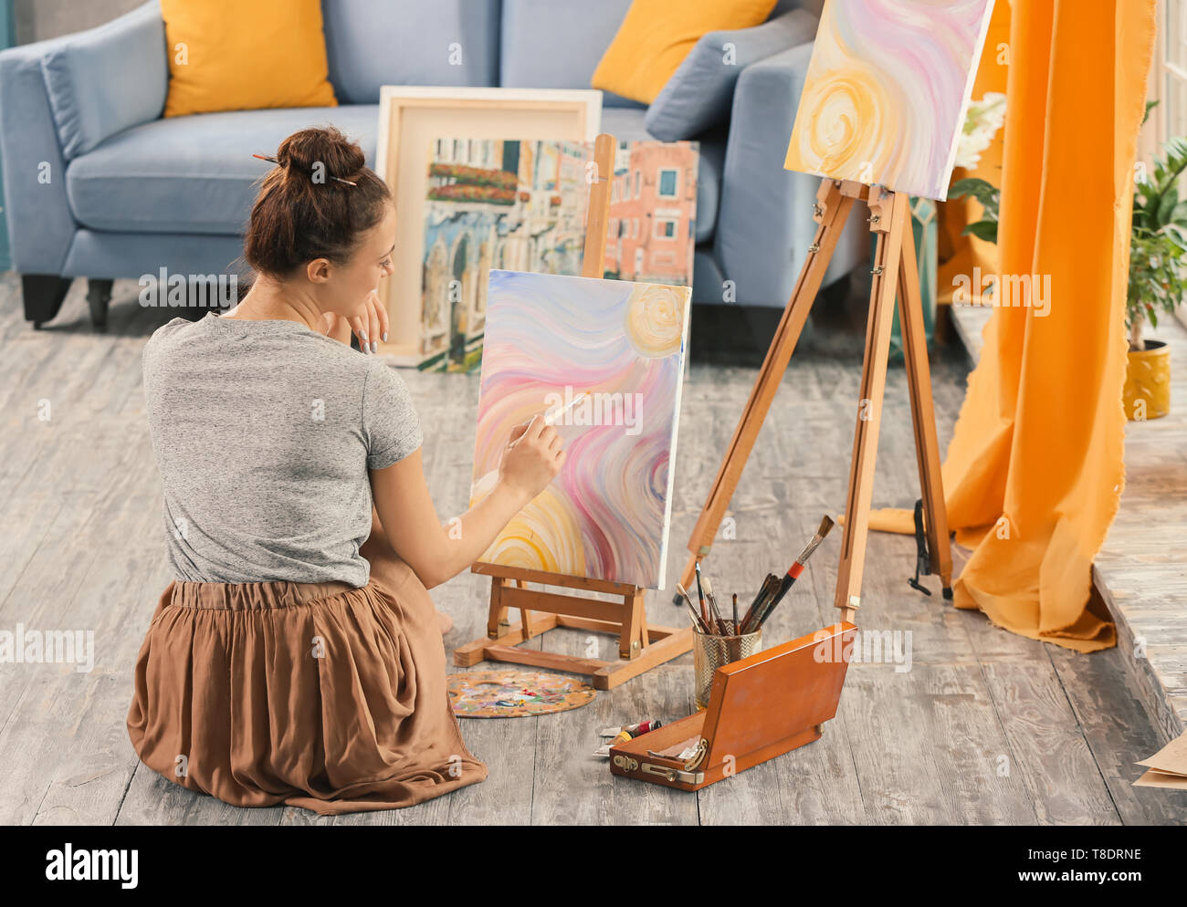 Artist female paints masterpiece sitting hi-res stock photography and ...
