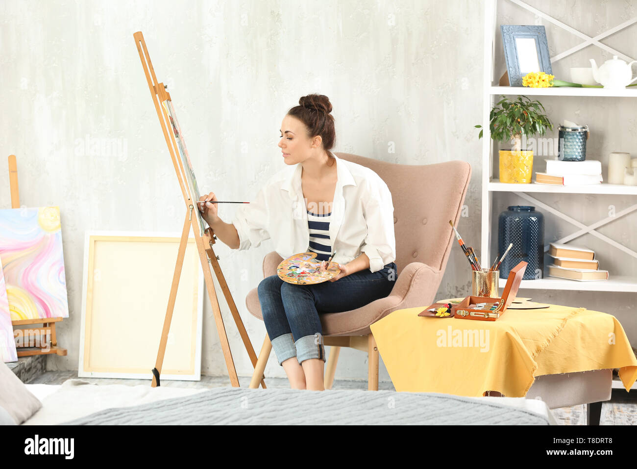 Artist female paints masterpiece sitting hi-res stock photography and ...