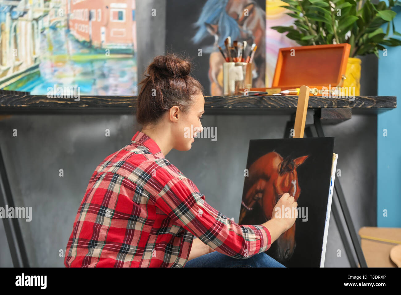 Artist female paints masterpiece sitting hi-res stock photography and ...