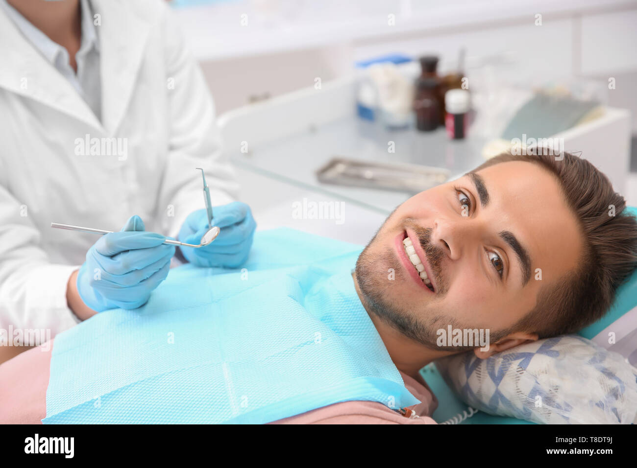 Hands male dentist examining teeth hi-res stock photography and images ...
