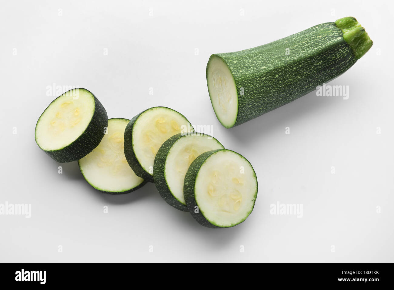 Fresh zucchini on white background Stock Photo - Alamy