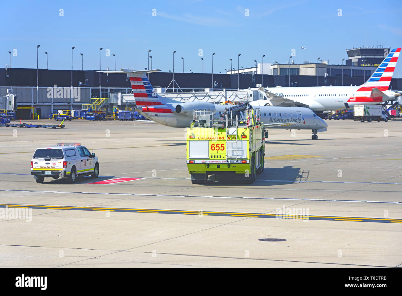 CHICAGO, IL -21 APR 2019- View of a yellow firetruck near an American ...