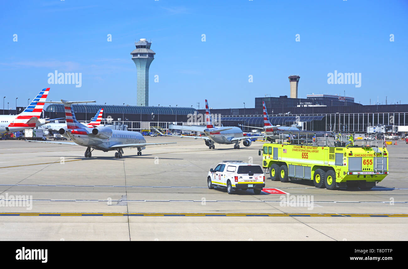 CHICAGO, IL -21 APR 2019- View of a yellow firetruck near an American ...