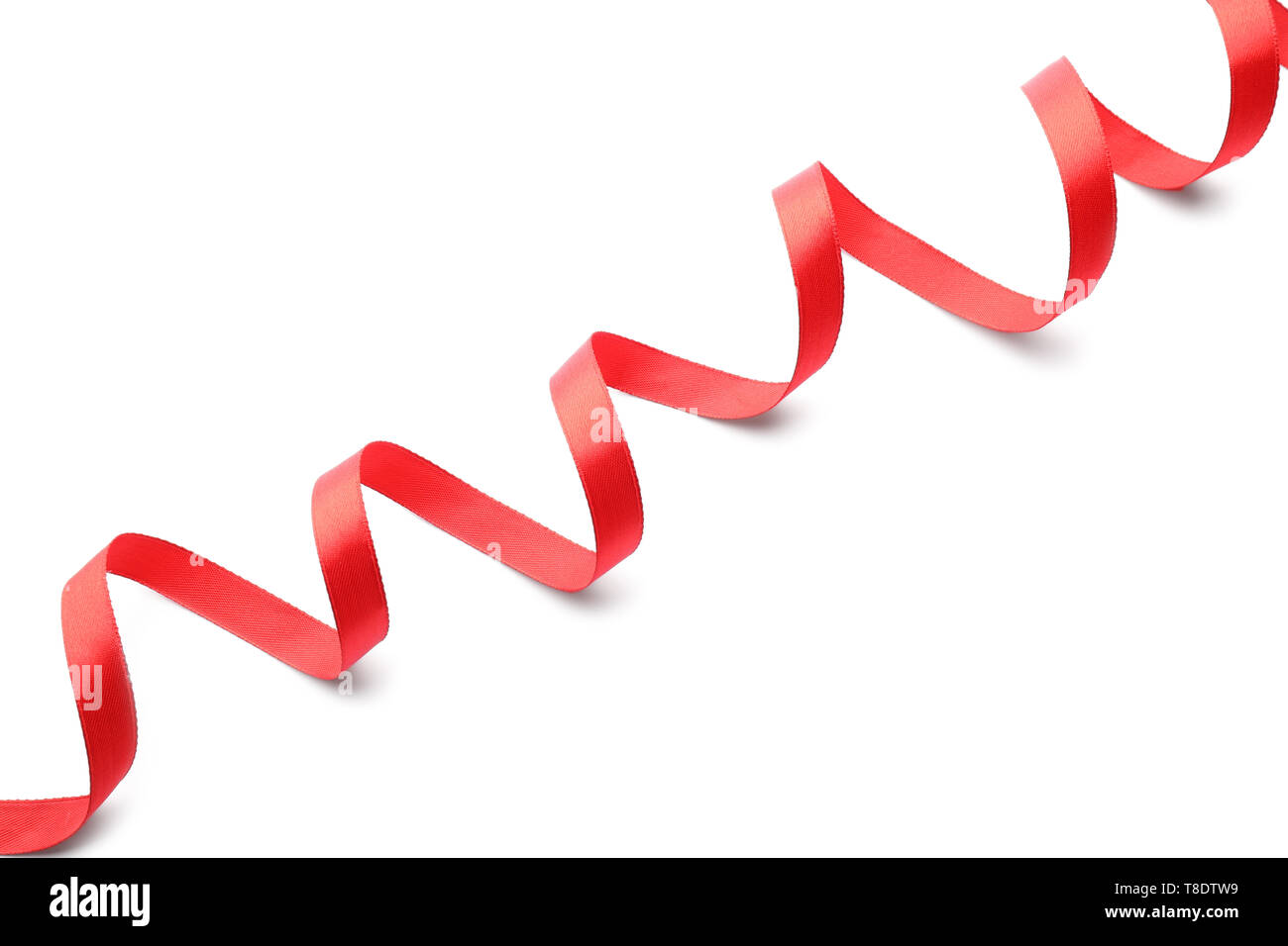 Curled red ribbon on white background Stock Photo - Alamy