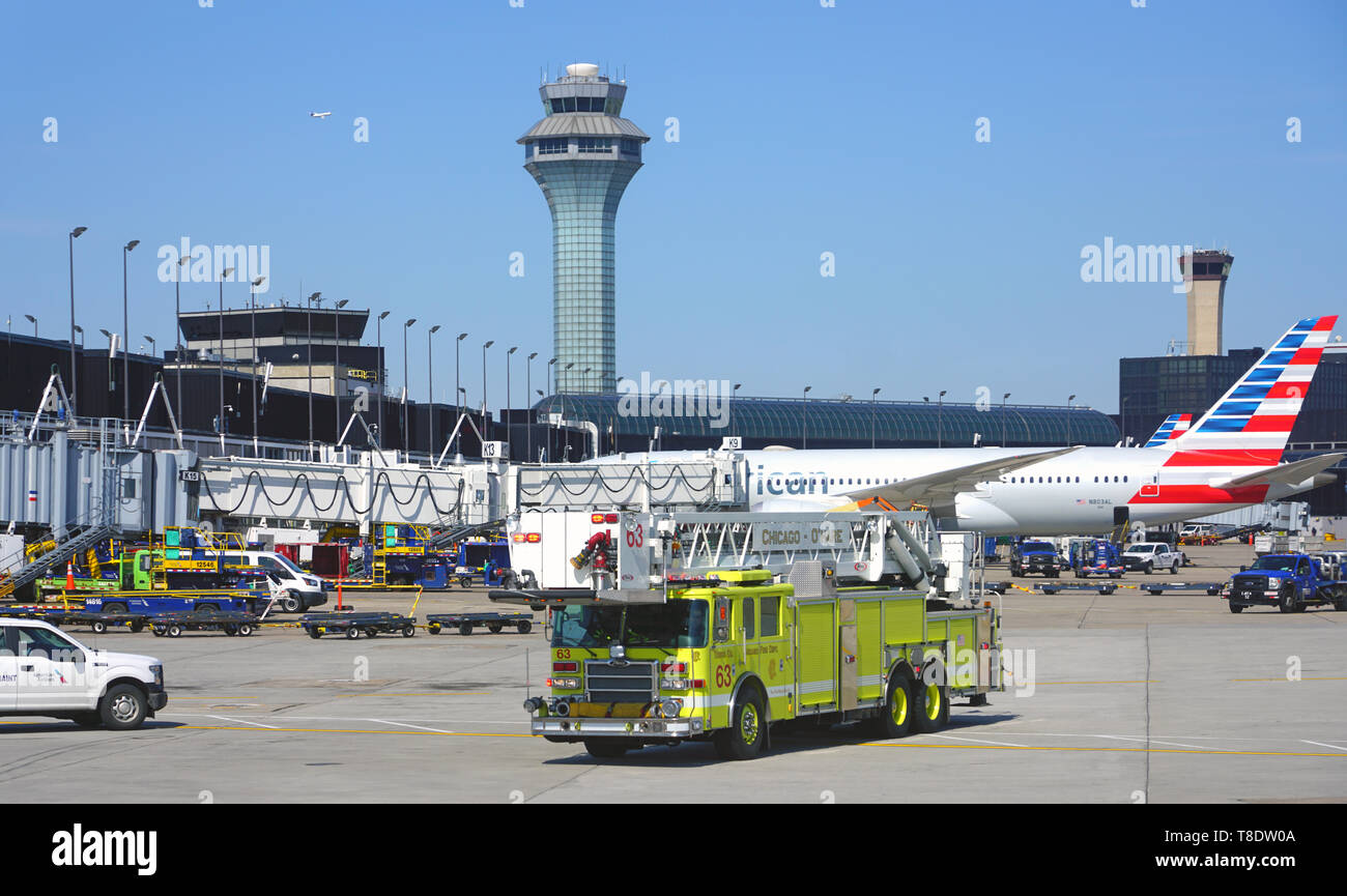 CHICAGO, IL -21 APR 2019- View of a yellow firetruck near an American ...