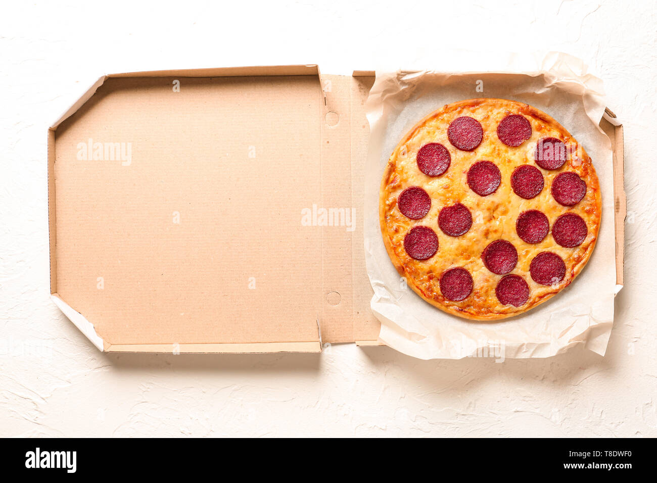 Tasty Pepperoni pizza in cardboard box on white background Stock Photo ...