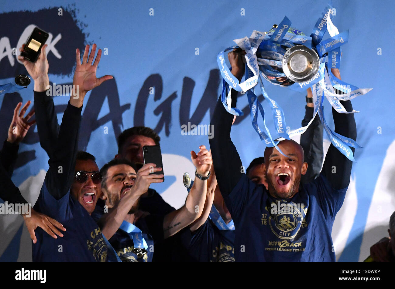 Manchester City's Vincent Kompany on stage with the trophy during the ...